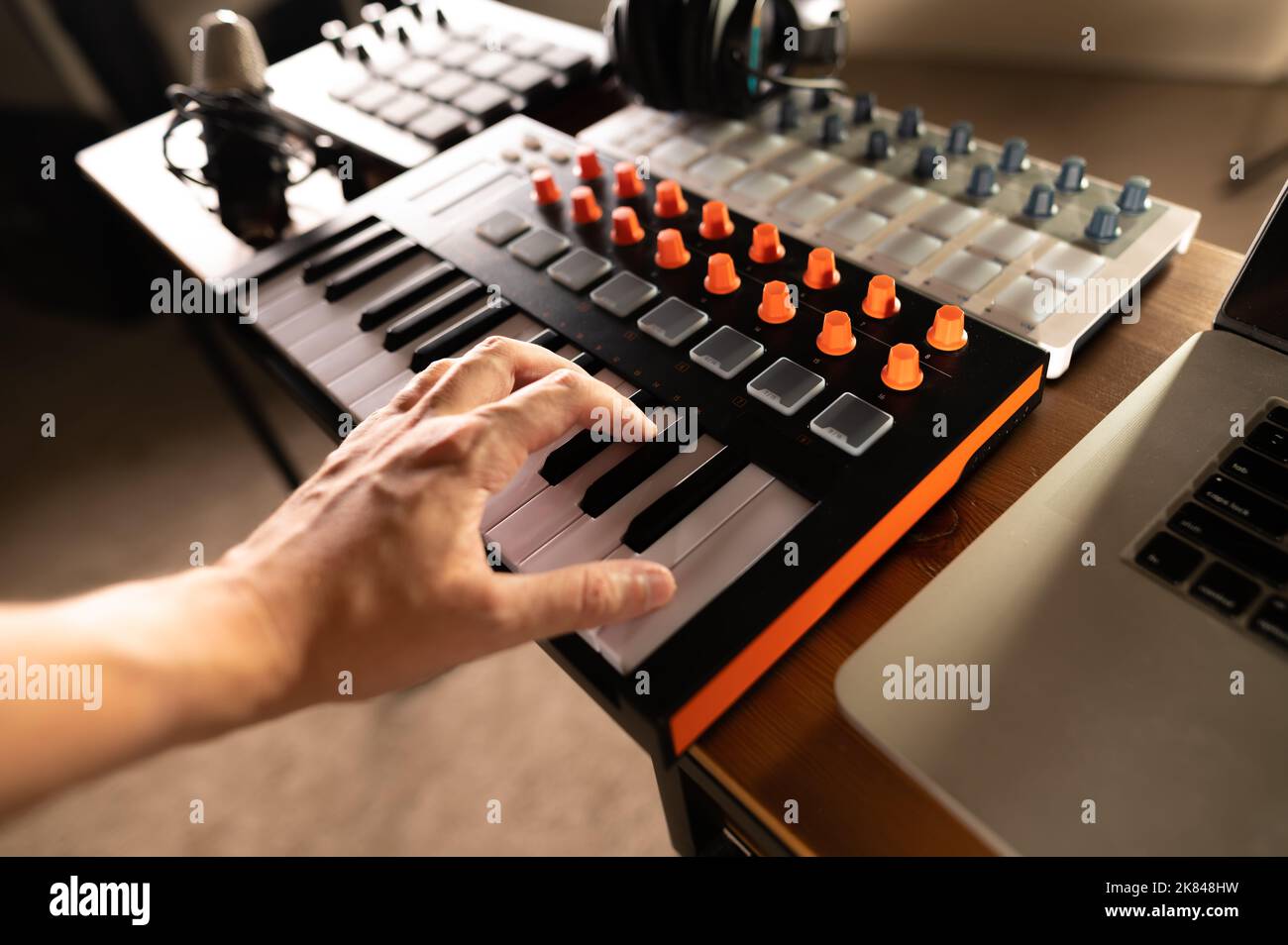 Modern studio equipment. Studio headphones on midi keyboard, studio ...