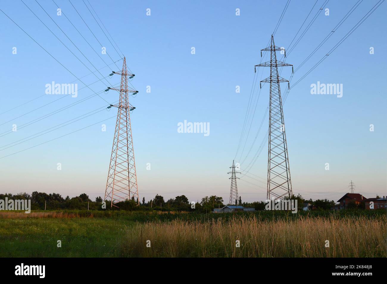 Transmission towers carrying high voltage electric power lines ...