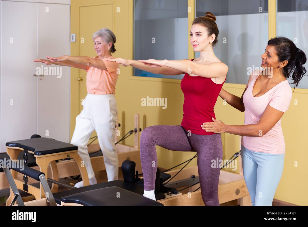 Active women perform exercises with outstretched arms Stock Photo - Alamy