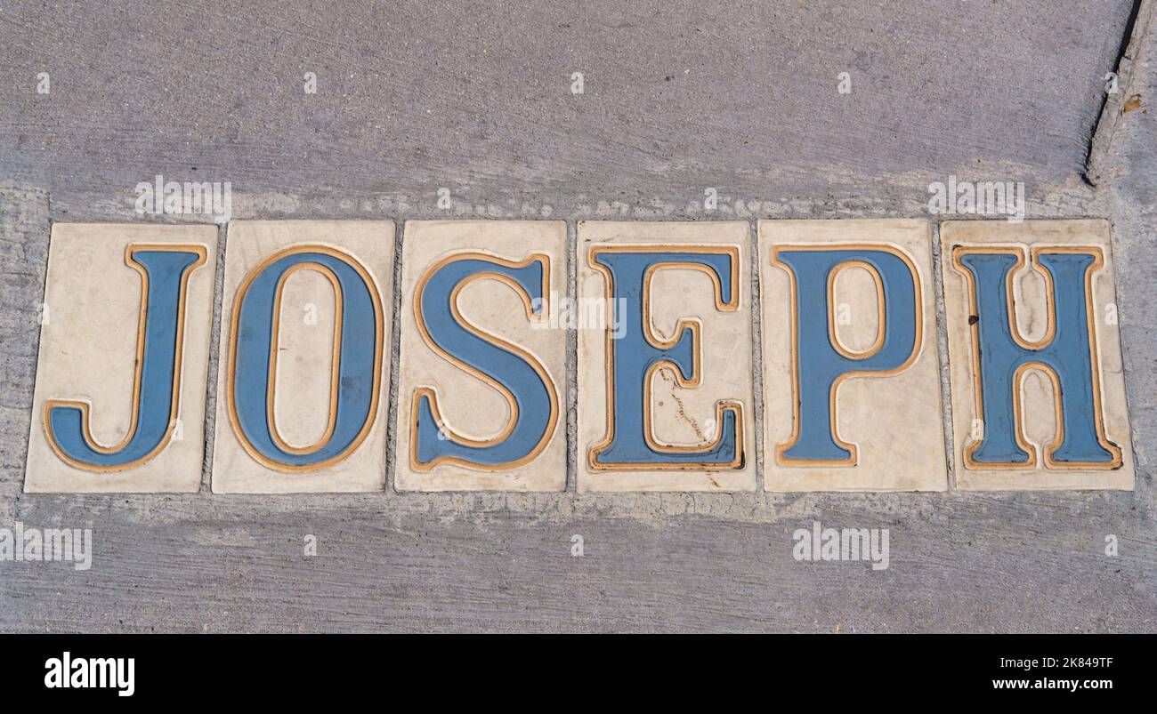 Sidewalk tile street sign hi-res stock photography and images - Alamy