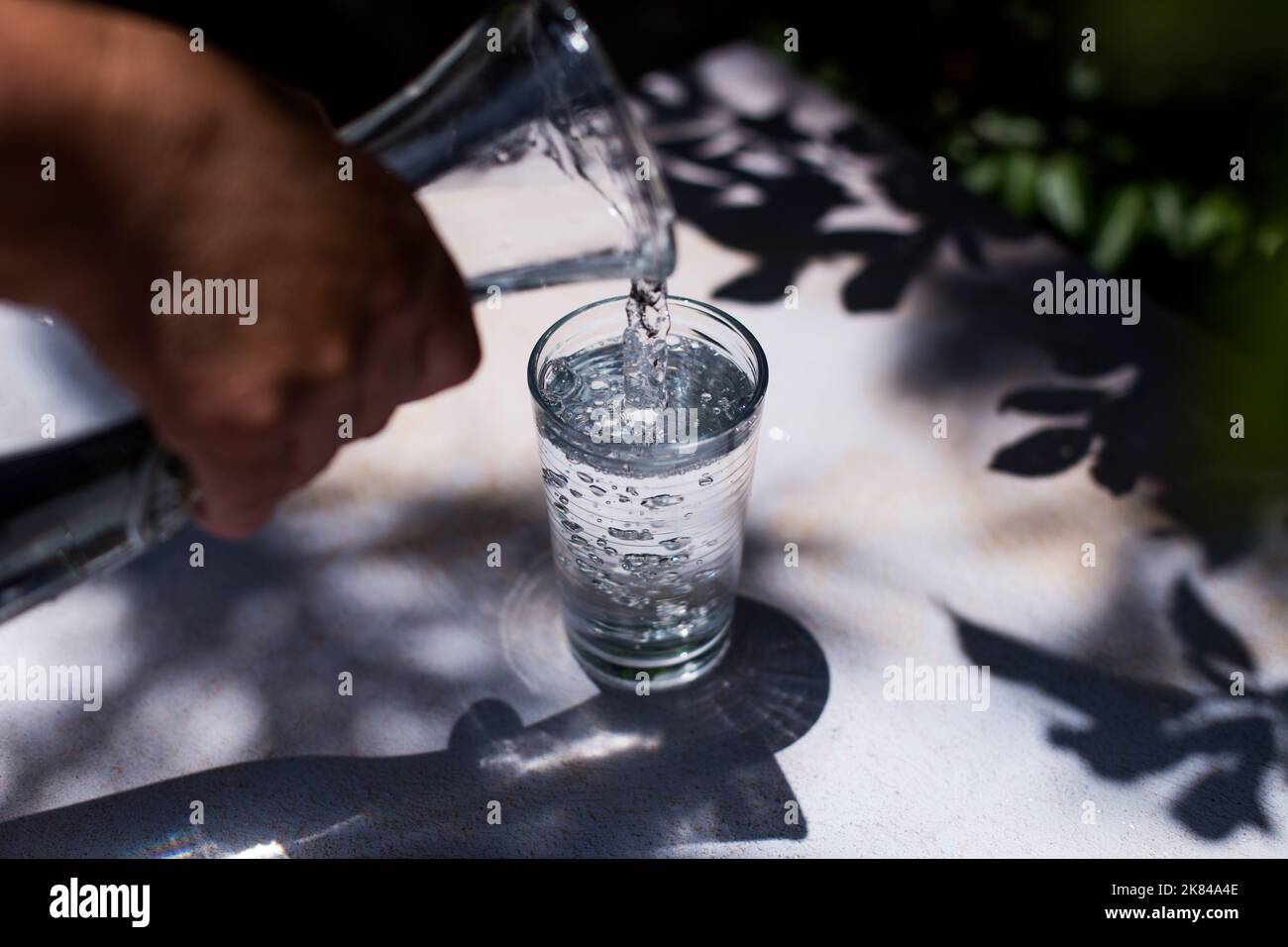 Pouring water in a glass beaker. Concept of healthy beverages Stock ...