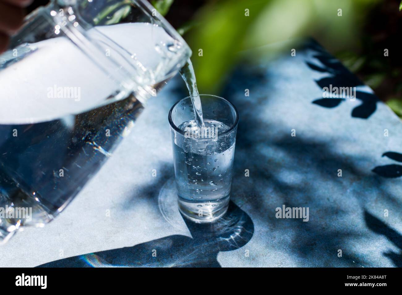 Pouring water in a glass beaker. Concept of healthy beverages Stock ...