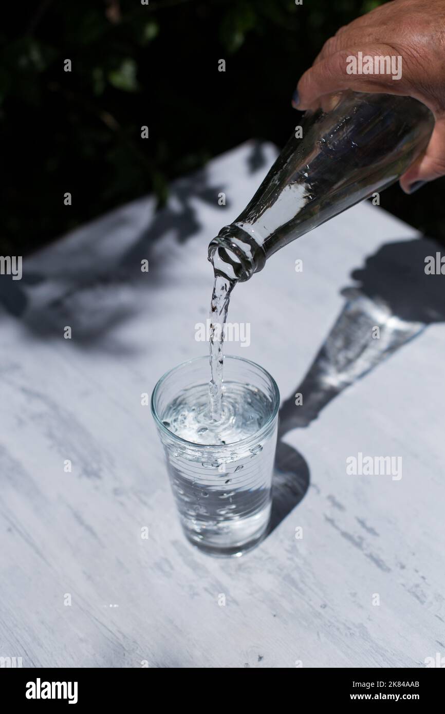 Pouring water in a glass beaker. Concept of healthy beverages Stock ...