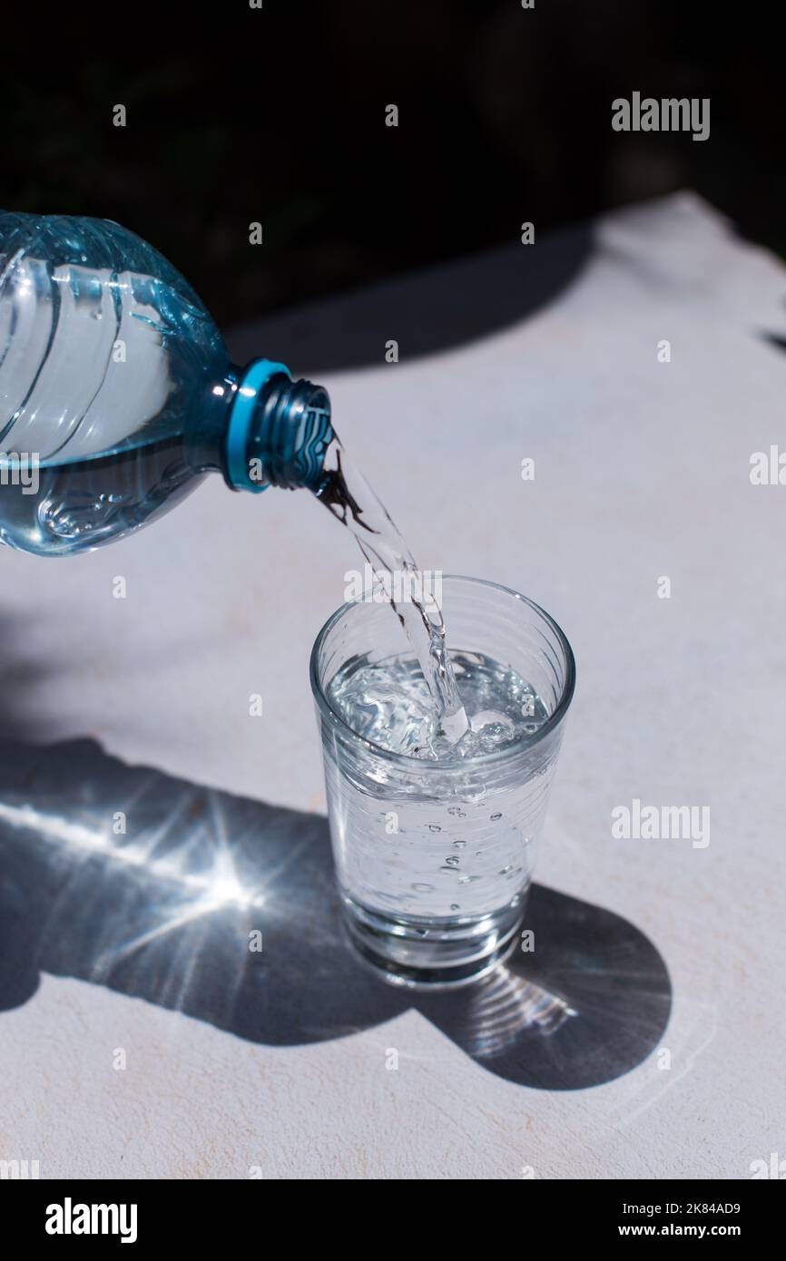 Pouring water in a glass beaker. Concept of healthy beverages Stock ...