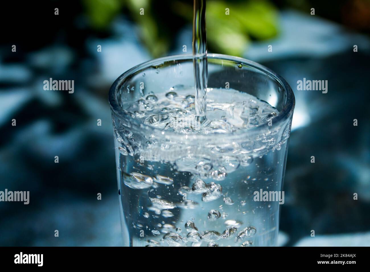 Pouring water in a glass beaker. Concept of healthy beverages Stock ...