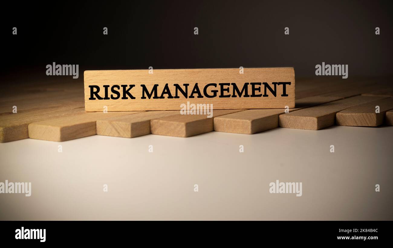 Risk management written on wooden frame. Wooden patterns Stock Photo ...