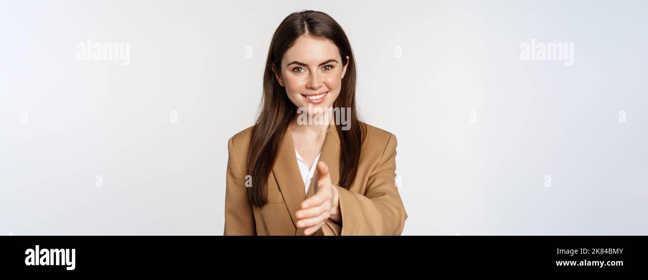 Portrait of smiling businesswoman extend hand for handshake, greeting ...