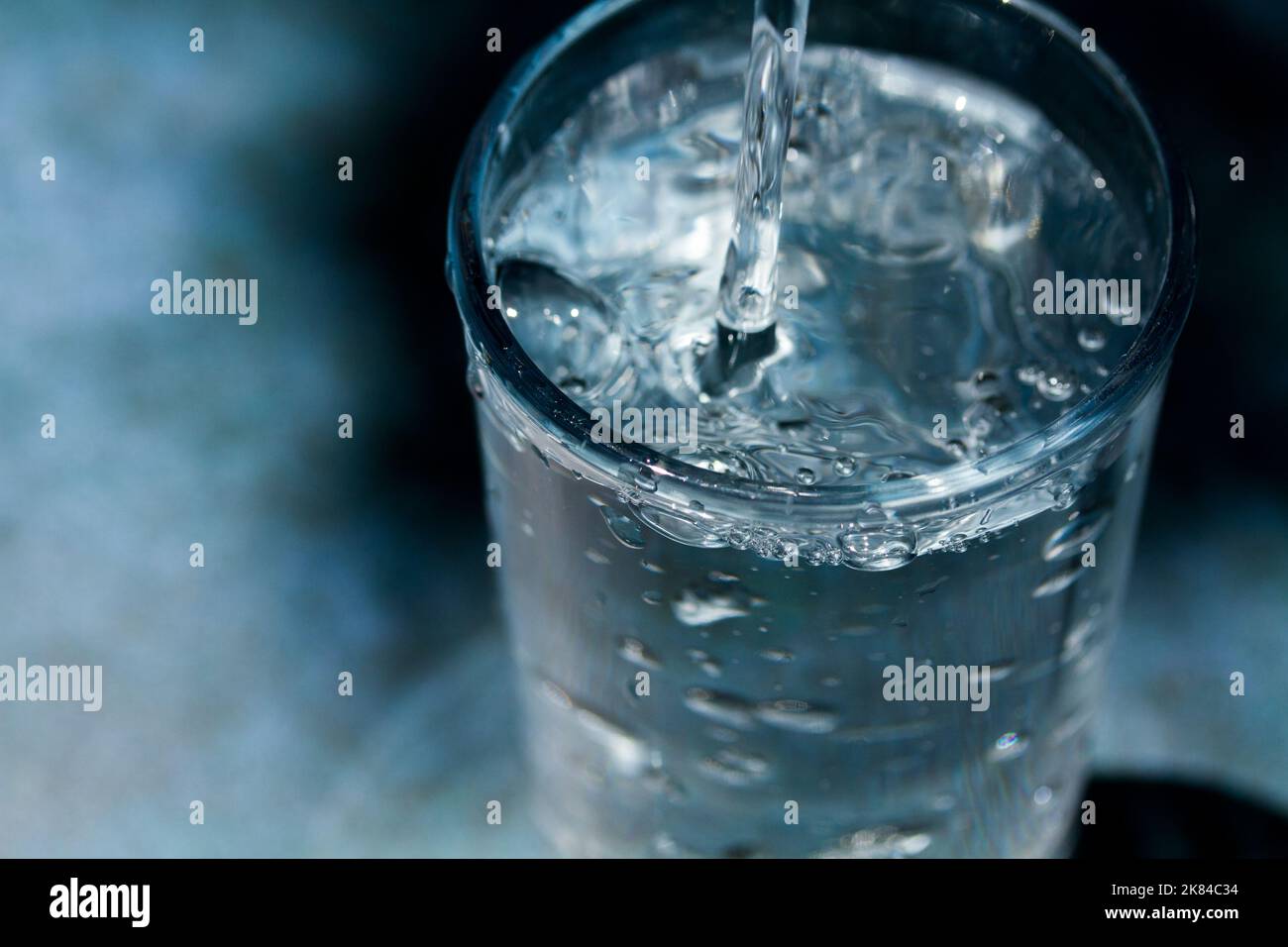 Pouring water in a glass beaker. Concept of healthy beverages Stock ...