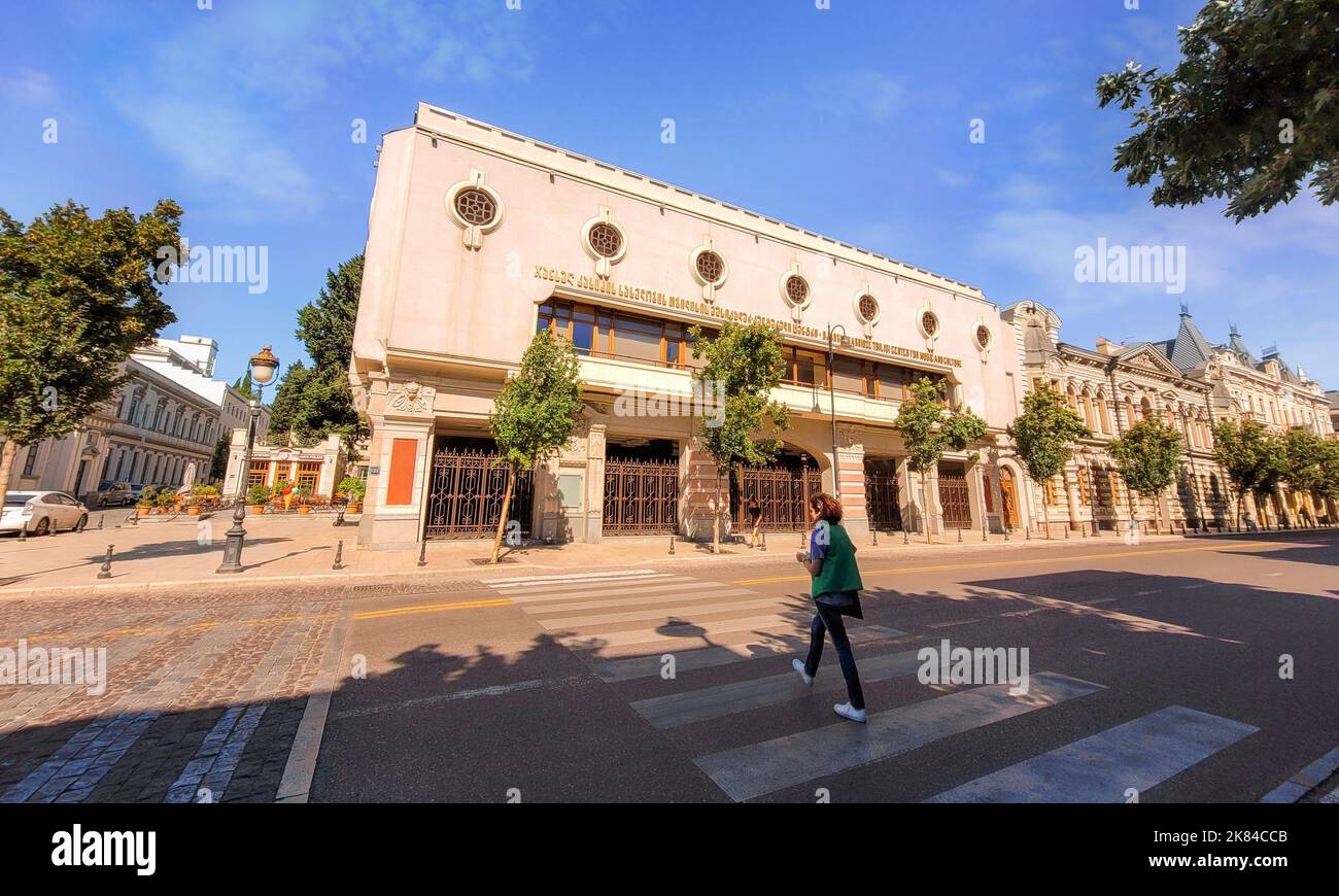 Tbilisi, Georgia - 07 23 2022: Young lady in green vest is crossing ...