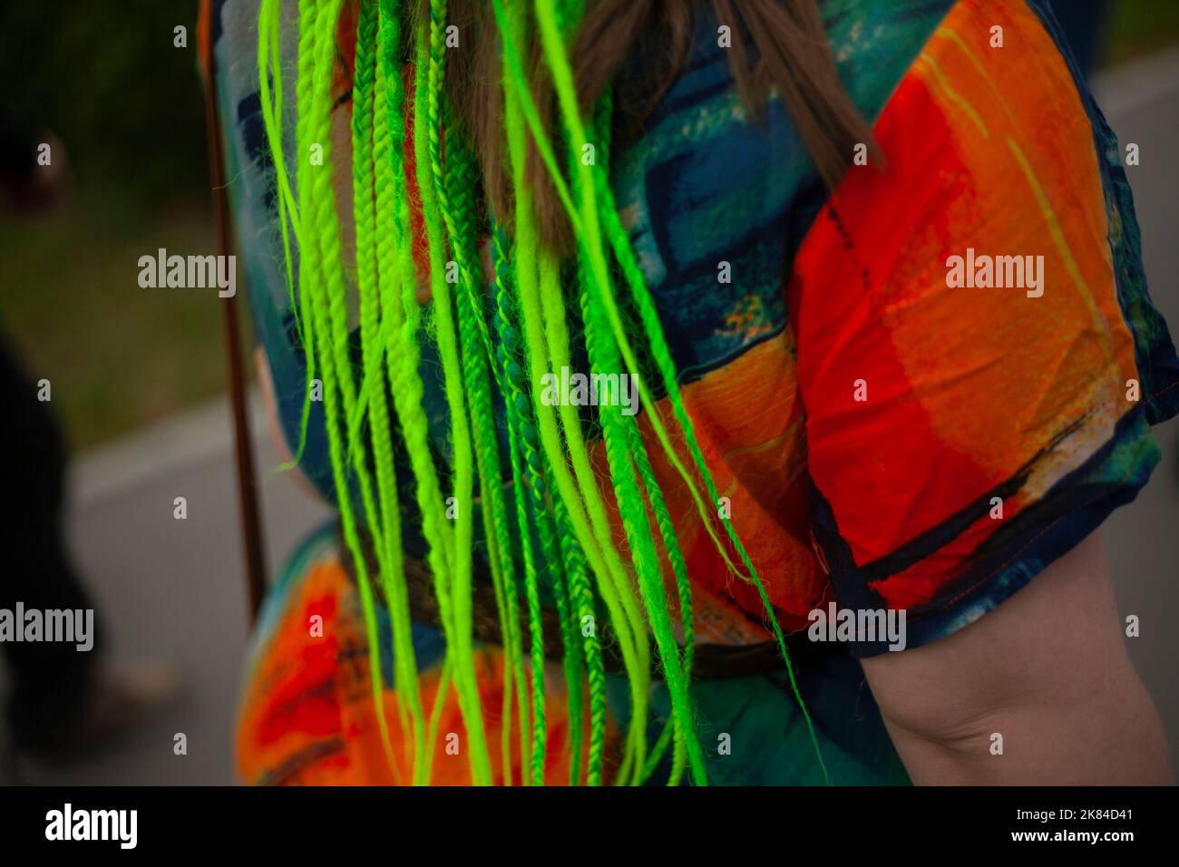 Green hair. Artificial hair is green. Bright dreadlocks. Stylish ...