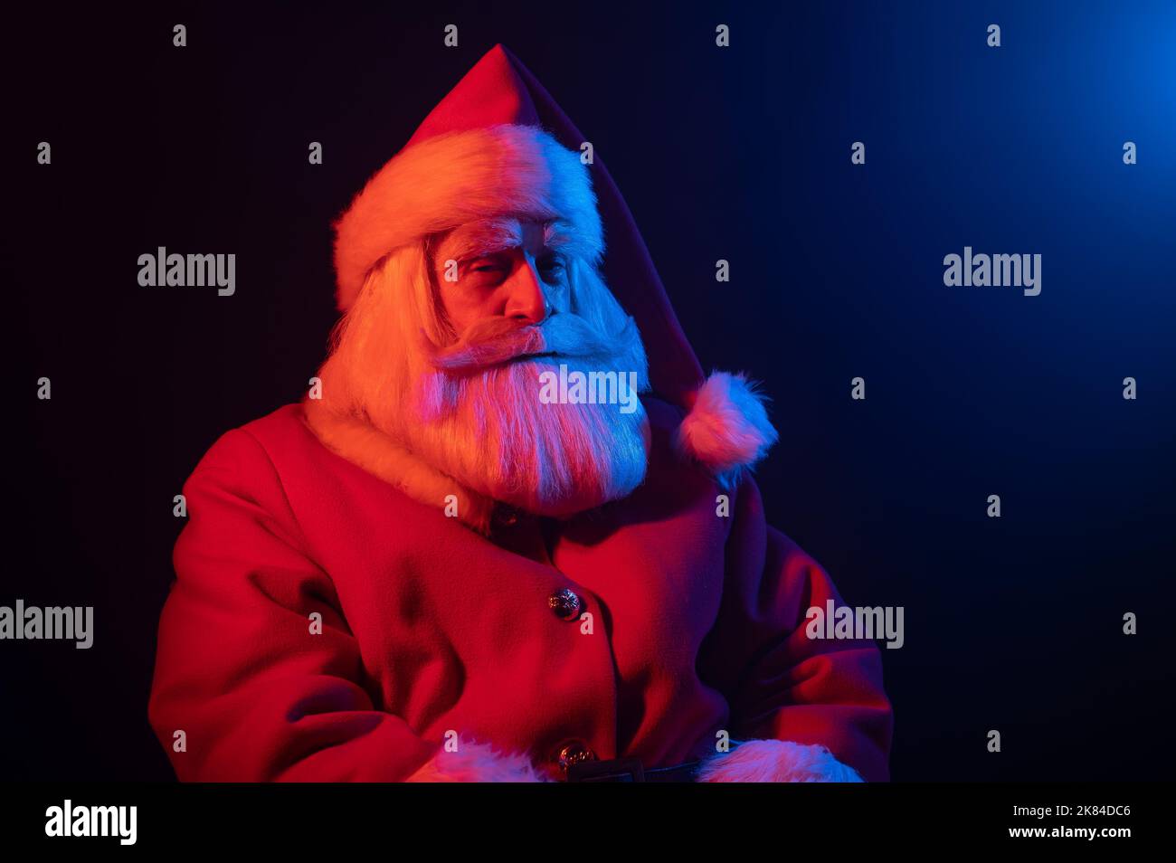 Santa Claus portrait in blue red neon light and smoke Stock Photo - Alamy