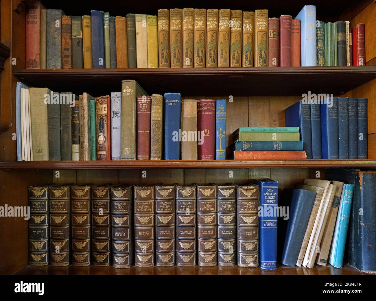 Shelf of old books in a home library Stock Photo - Alamy