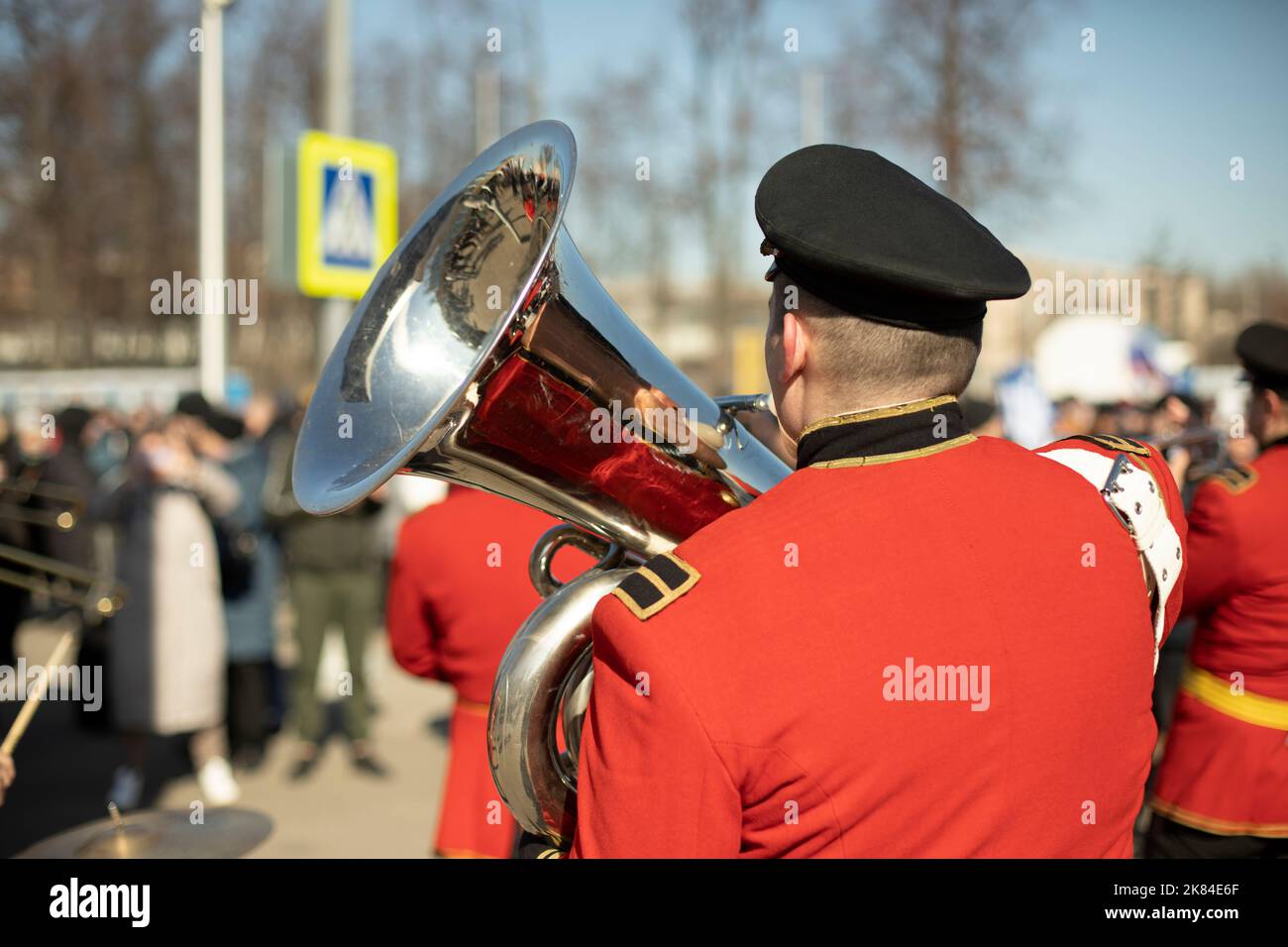 Orchestra with wind instruments. Trumpeters in ceremonial uniforms. Red ...