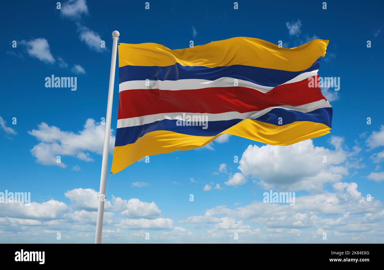 flag of Mengjiang, asia at cloudy sky background, panoramic view. flag ...