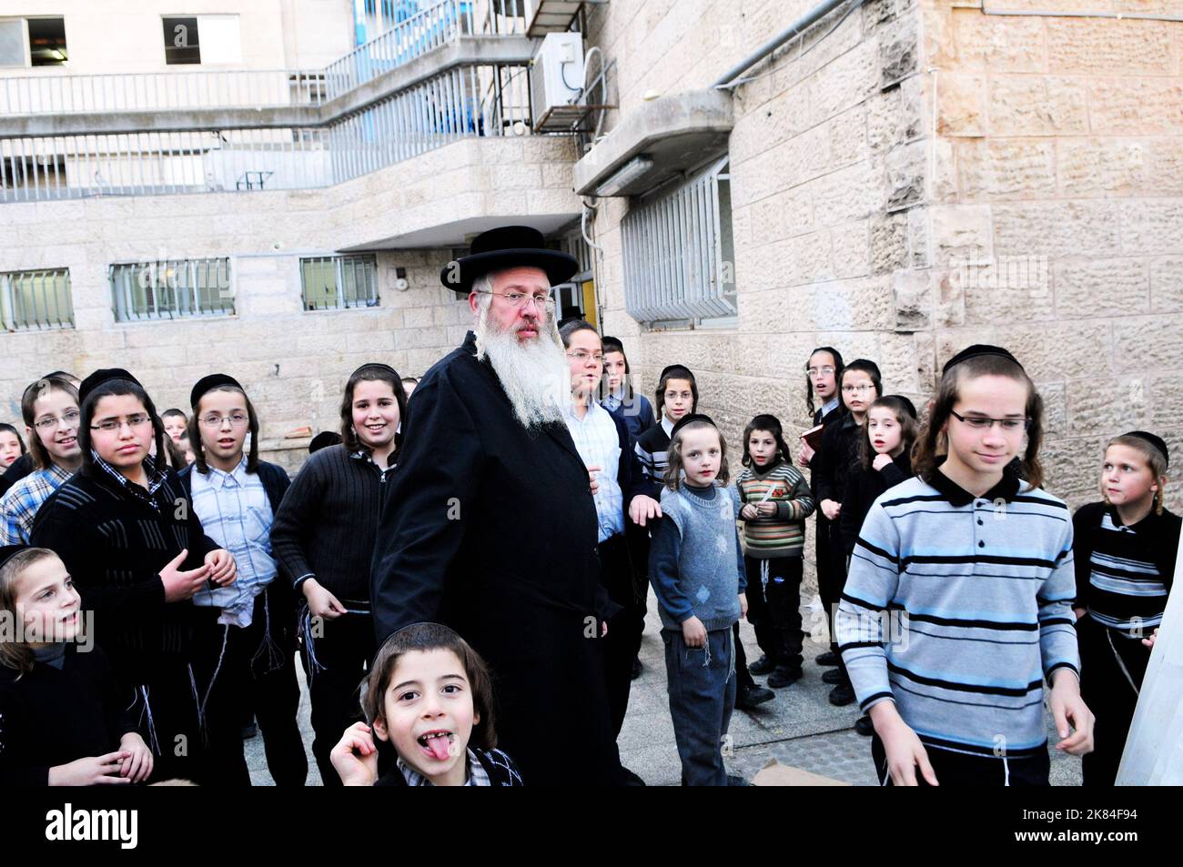 Cheerful & happy. Orthodox Jewish boys with their Rebbe in the ...