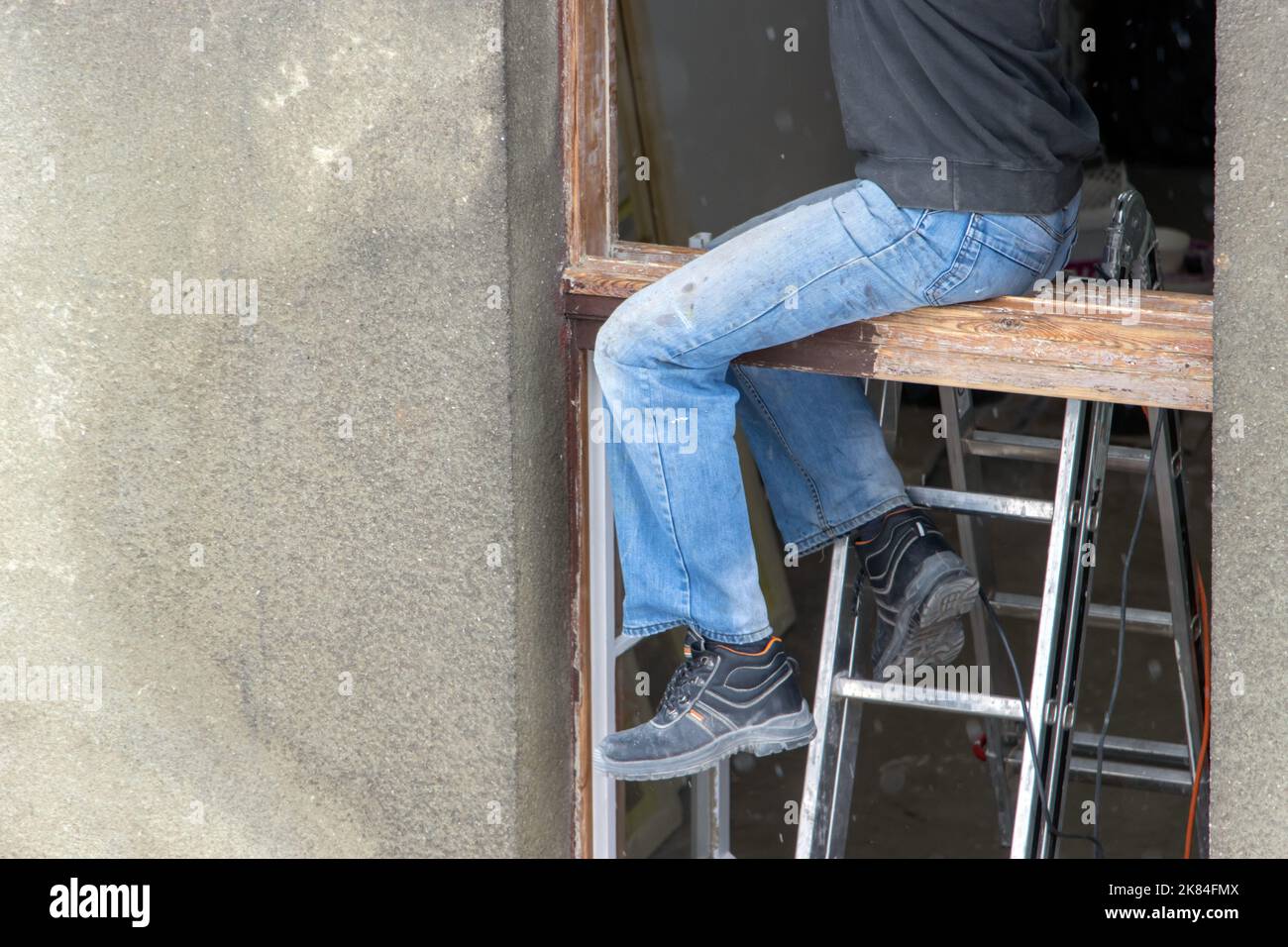 Man climbing window hi-res stock photography and images - Alamy