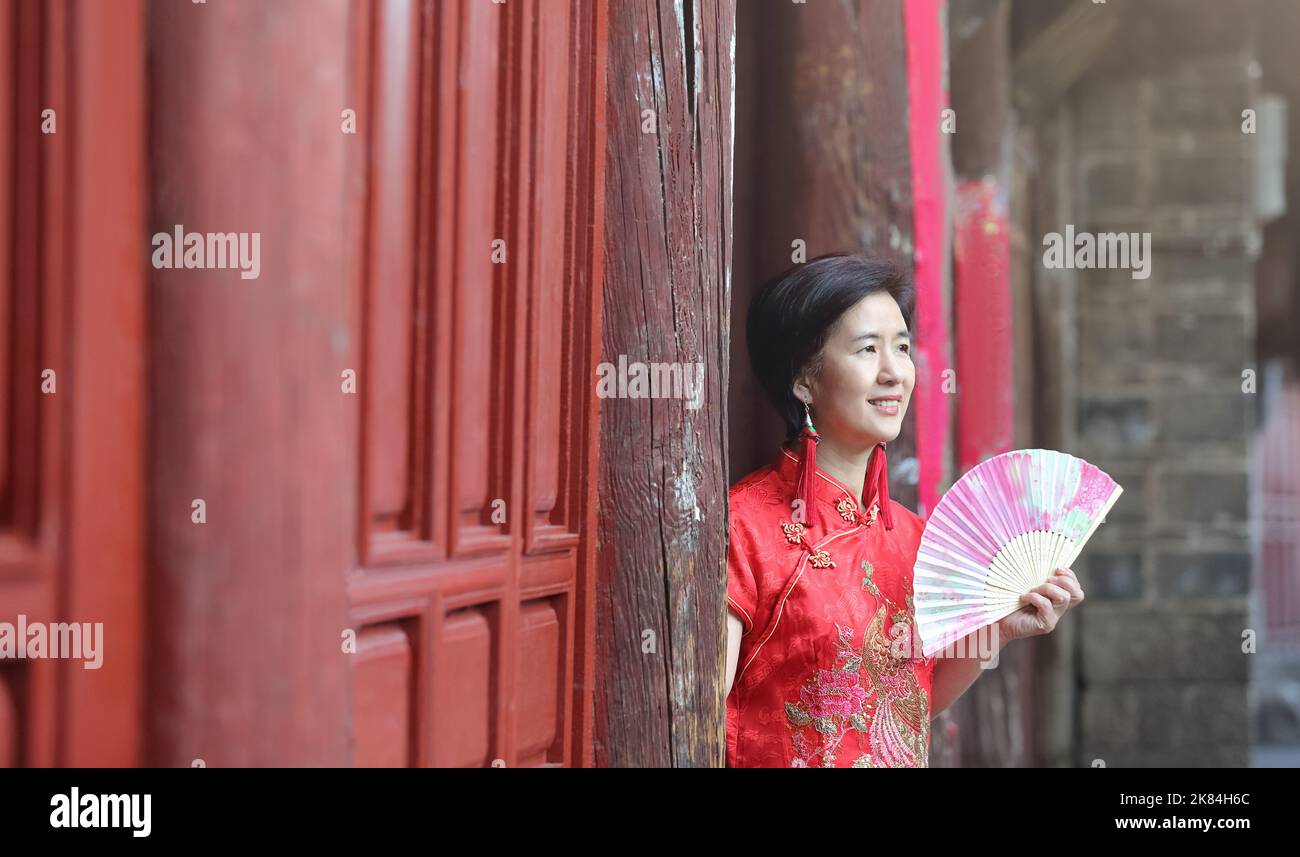 Female Tourist with Chinese Traditional Clothing in Lijiang Old town ...