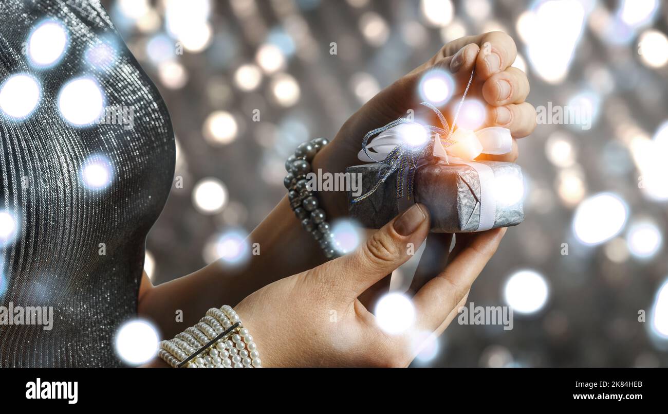 Closeup hands giving surprise gift box Stock Photo - Alamy