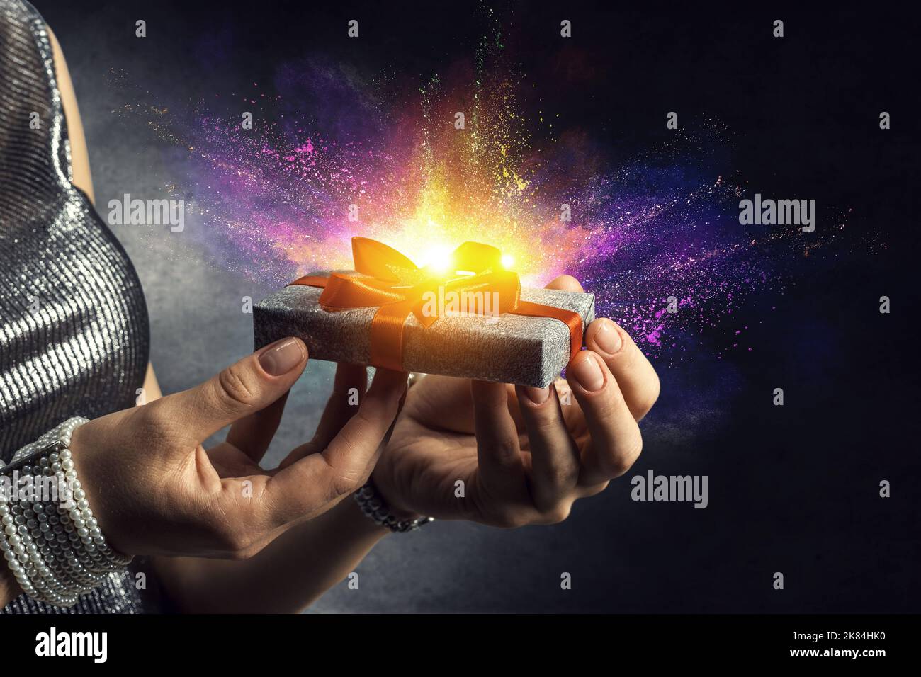 Closeup hands giving surprise gift box Stock Photo - Alamy