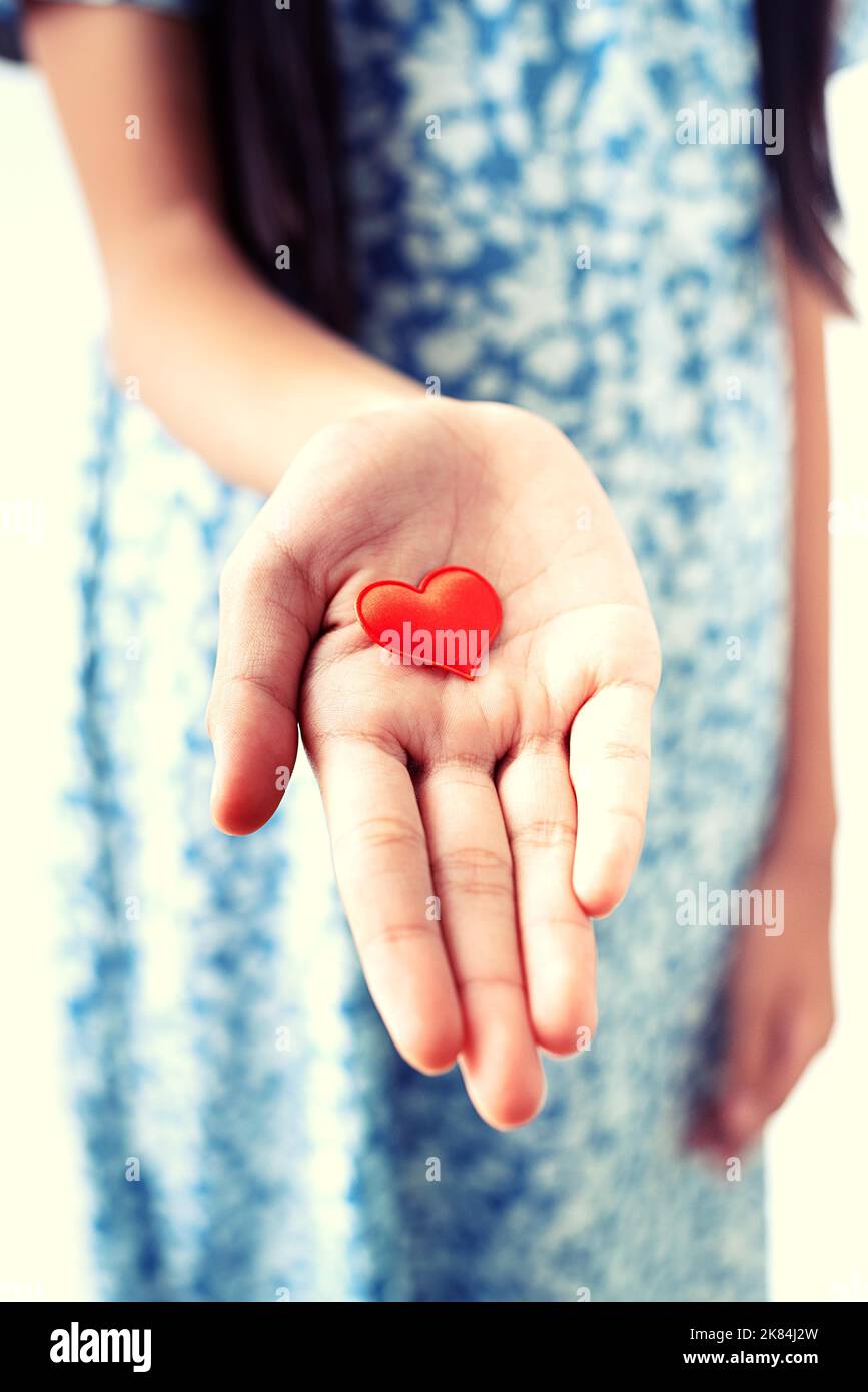 Close up girl's hand offering a heart Stock Photo - Alamy