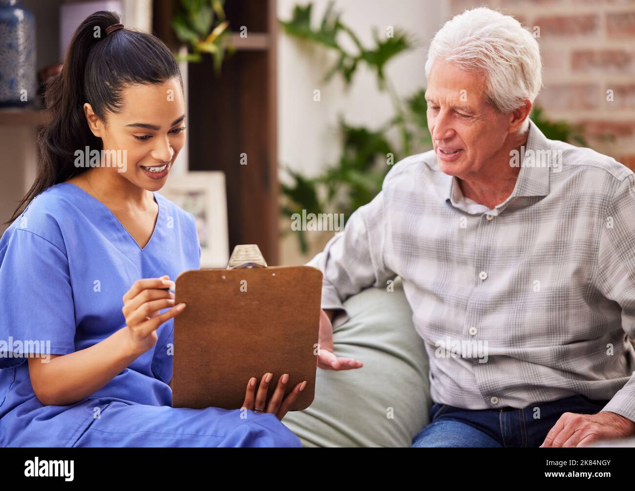 Yes i wanted to leave you something. a nurse going over paperwork with ...