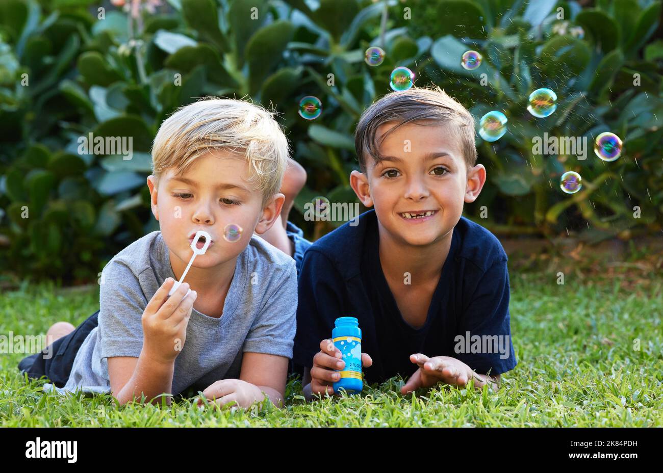 Nothing as beautiful as happy children. two adorable boys playing with ...