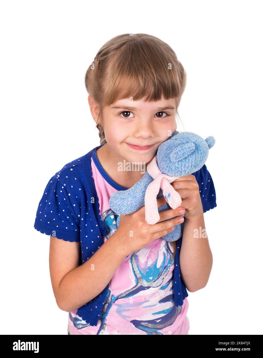 Little girl holding a teddy bear. Isolated on white background. Girl hugging two teddybears ...