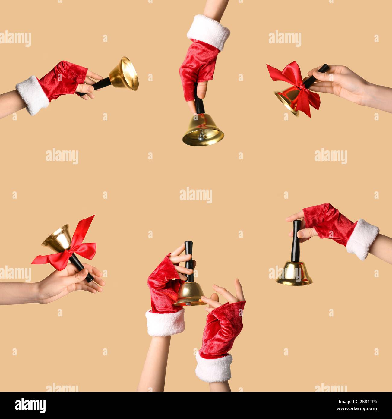 Many female hands with Christmas bells on beige background Stock Photo ...