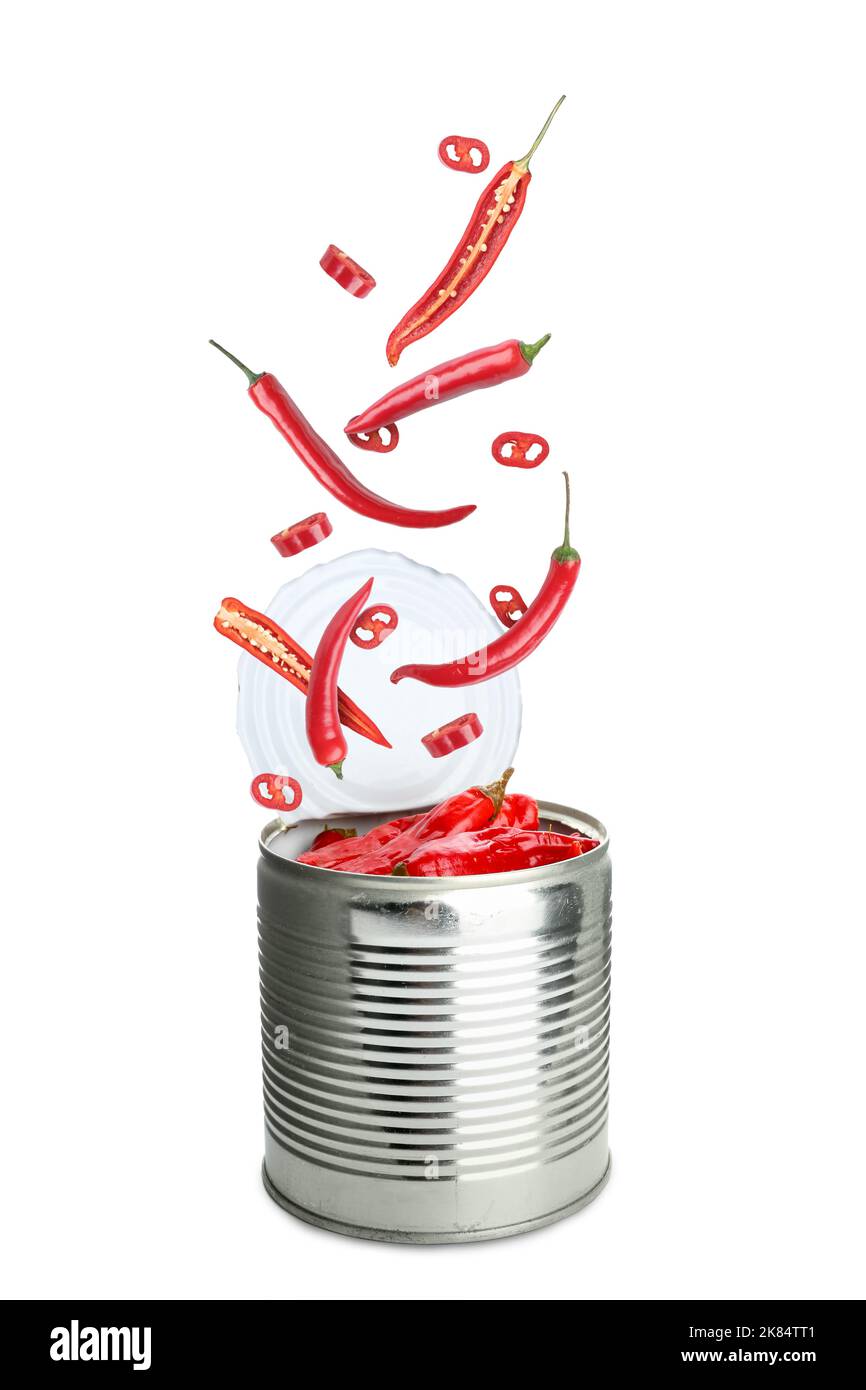 Open tin can with falling tasty chili peppers on white background Stock ...
