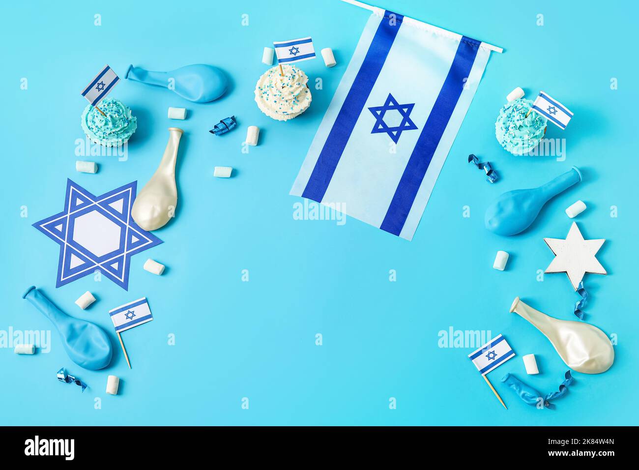 Composition with flags of Israel and festive decor on color background ...