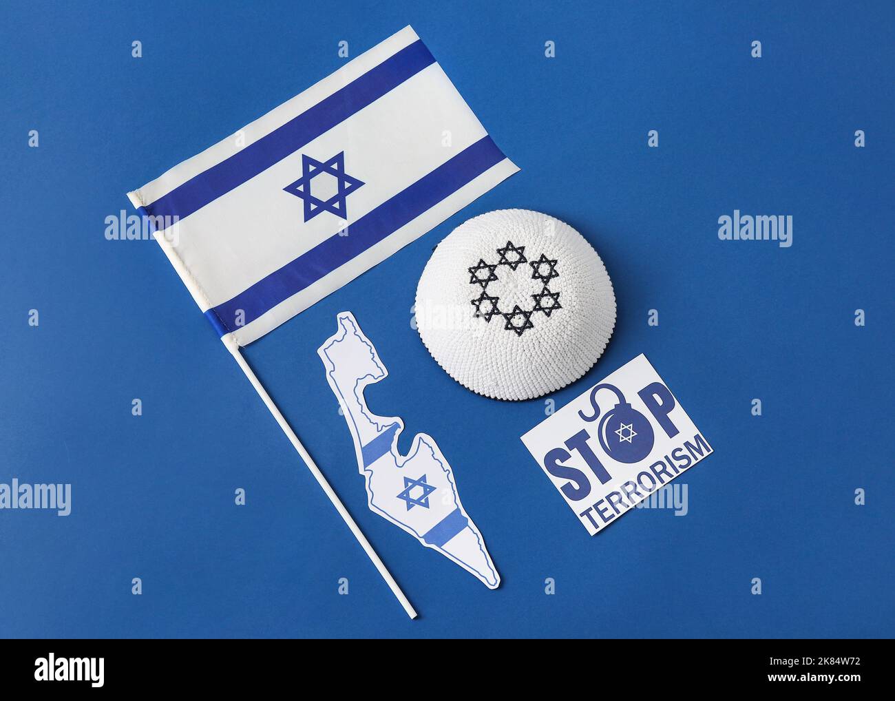 Flag of Israel, kippah and card with text STOP TERRORISM on color ...