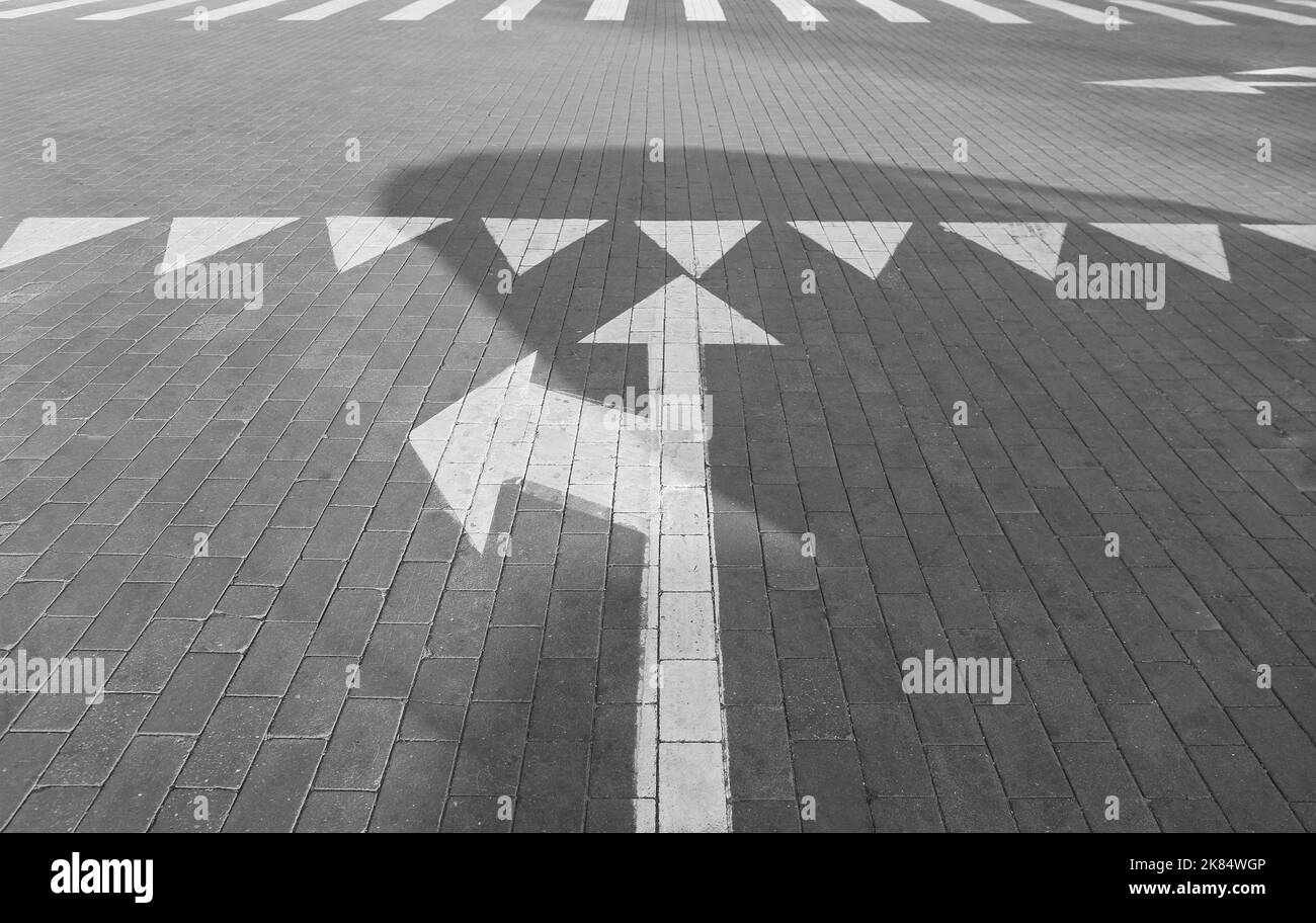 Direction mark on parking lot Stock Photo - Alamy