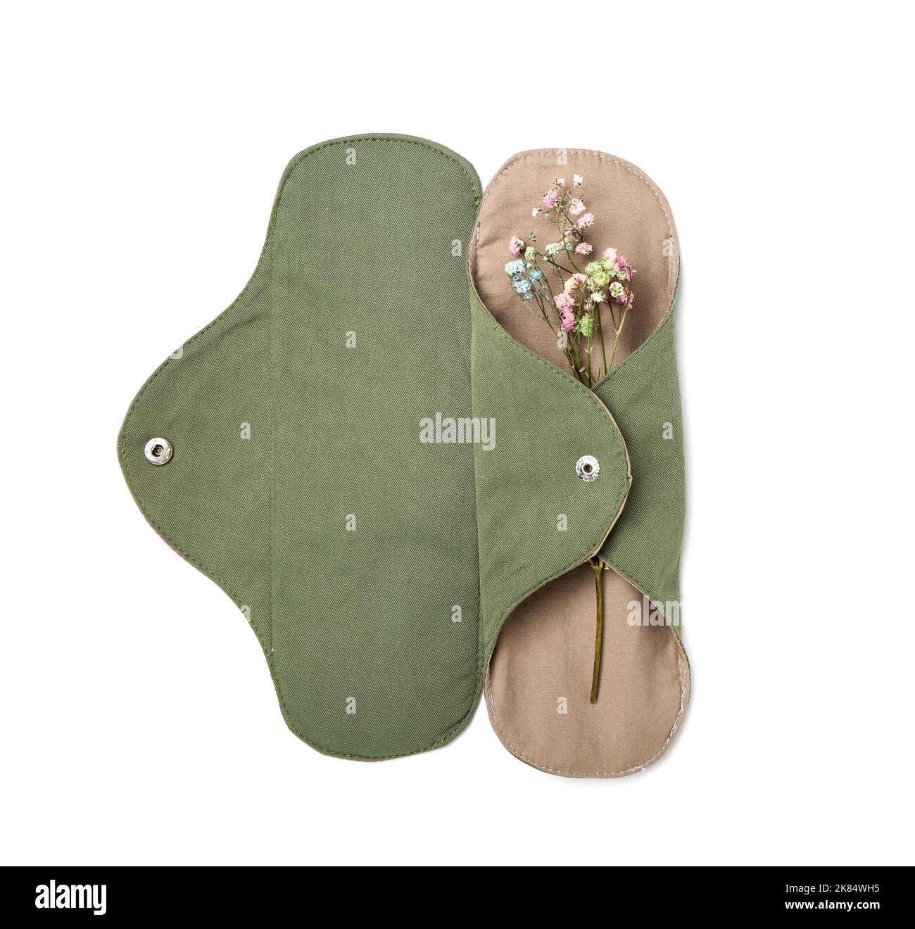 Reusable menstrual pads and flowers on white background Stock Photo - Alamy