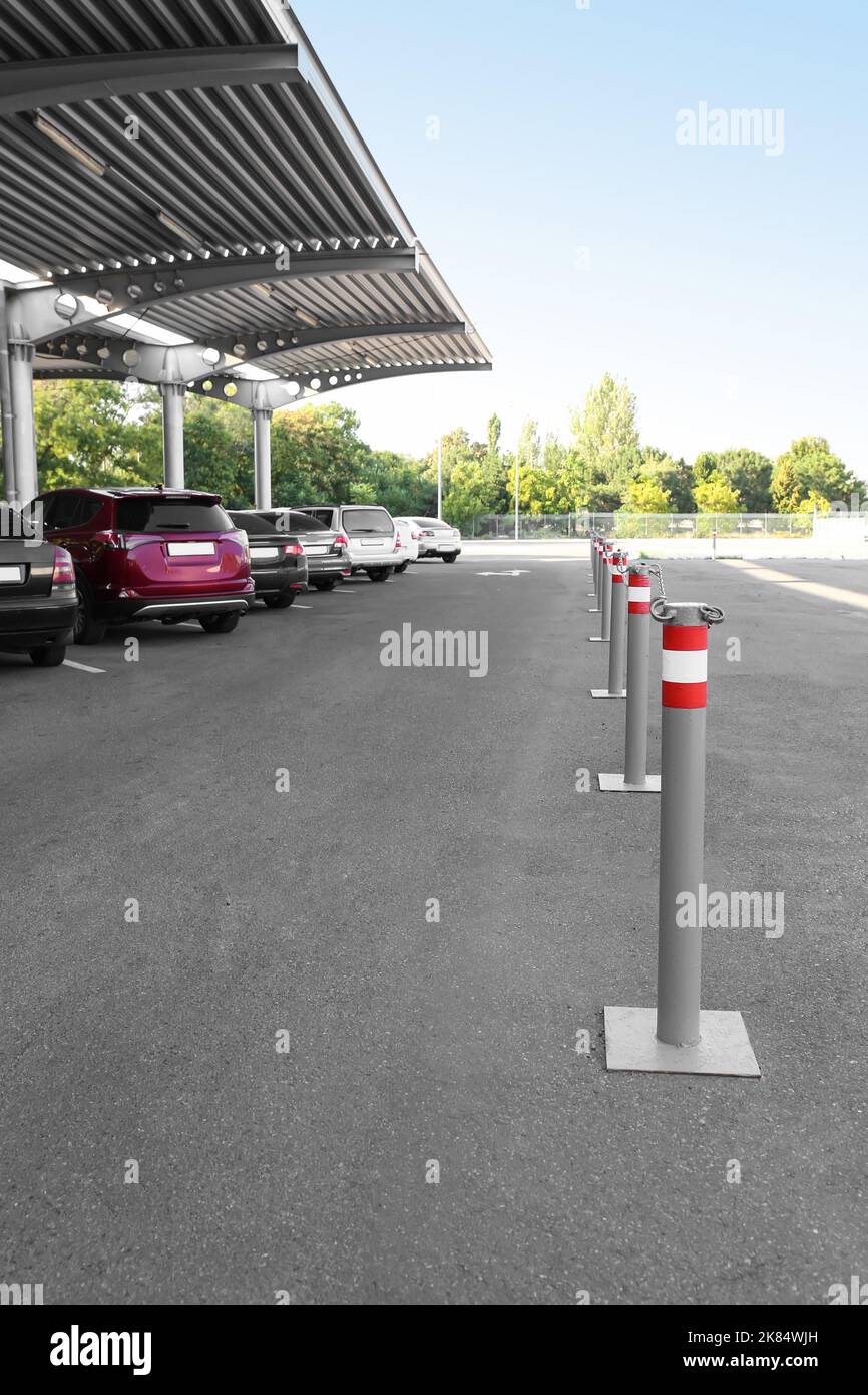 Limiters with red and white stripes on parking under canopy Stock Photo ...