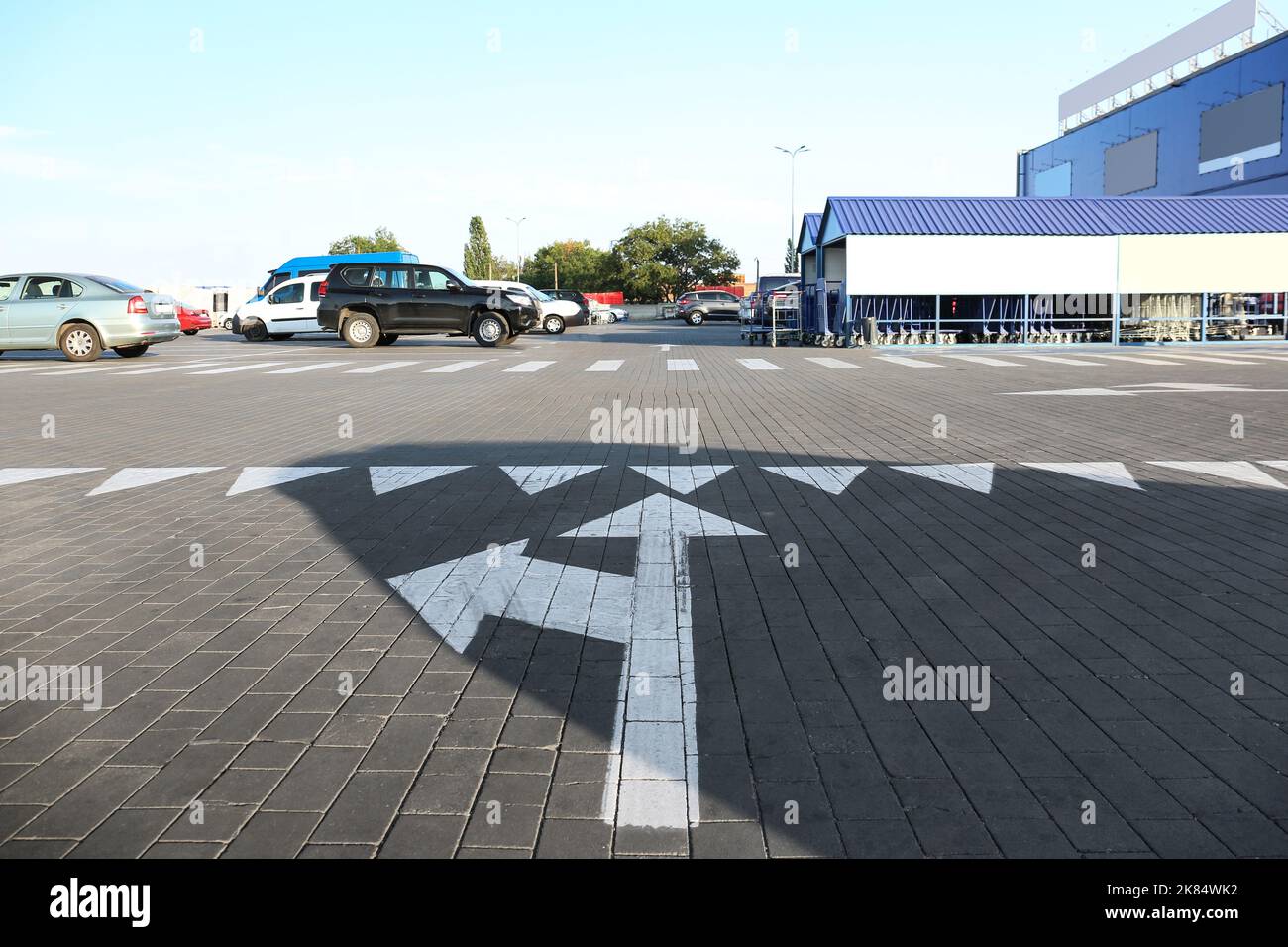 Direction mark on parking lot near supermarket Stock Photo - Alamy