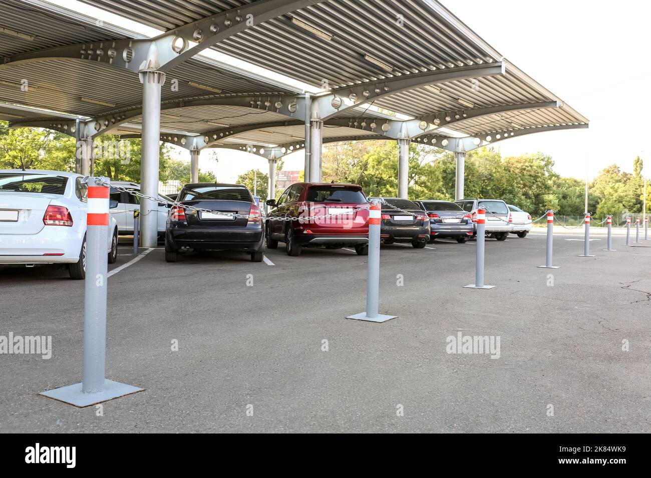 Limiters with red and white stripes on parking under canopy Stock Photo ...