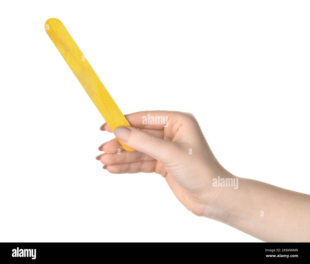 Female hand with yellow ice cream stick on white background Stock Photo ...