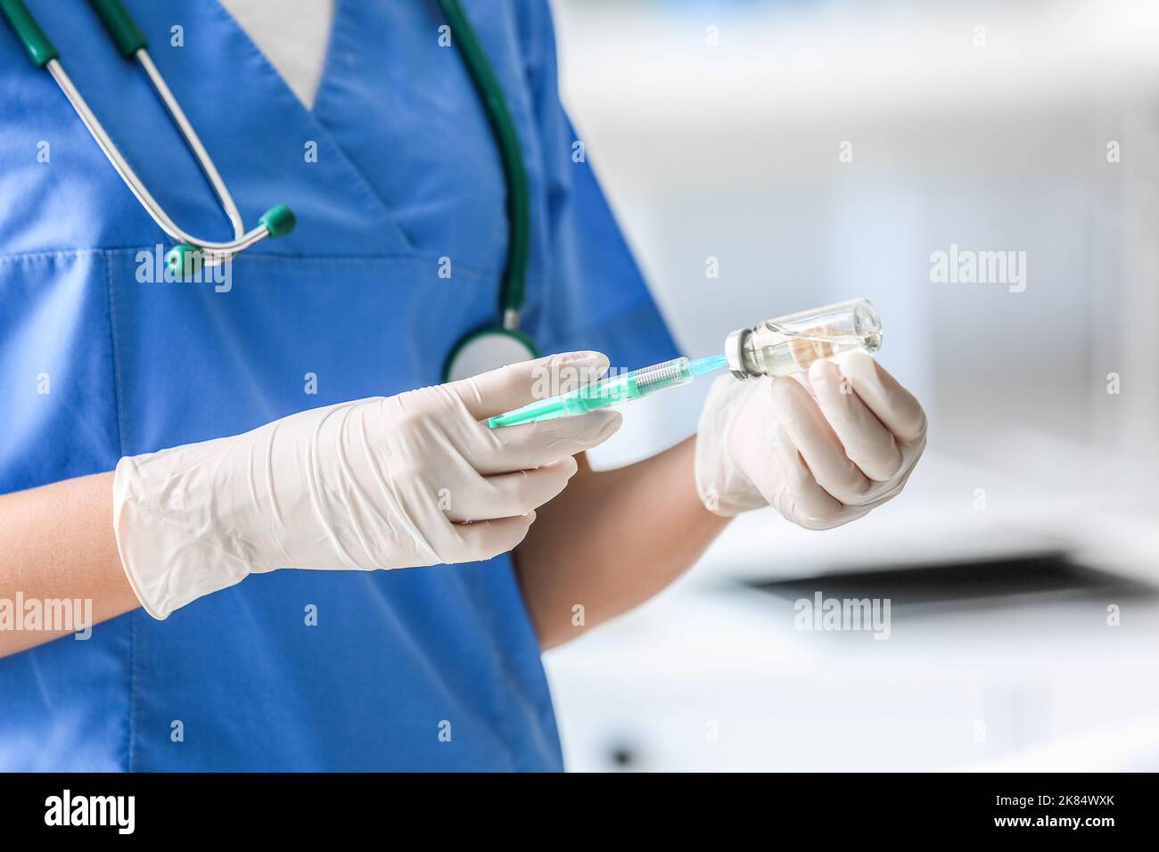 Female doctor with syringe and ampule in clinic, closeup Stock Photo ...
