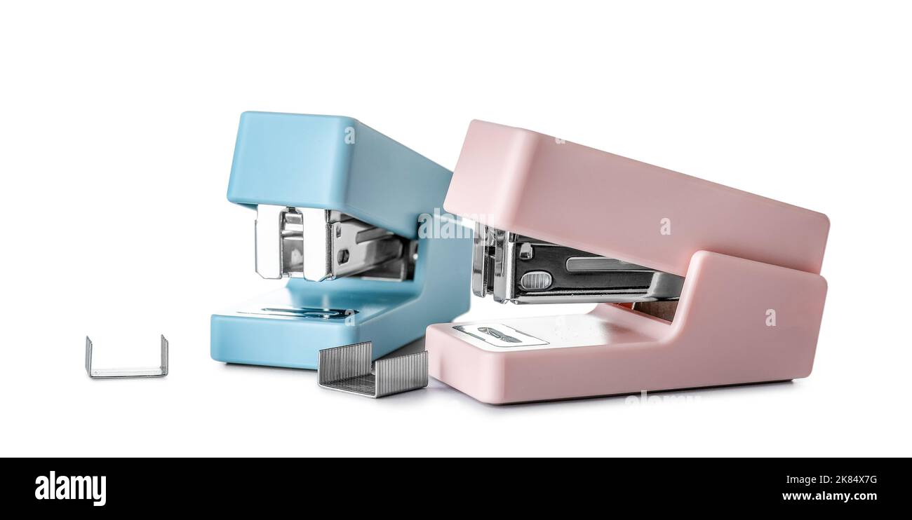 Staplers and staples on white background Stock Photo - Alamy