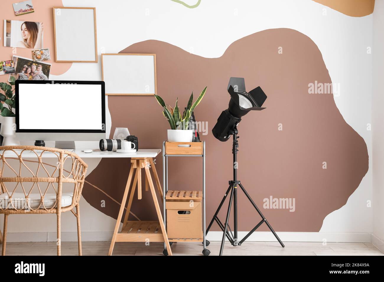 Interior of stylish office with photographer's workplace and equipment ...