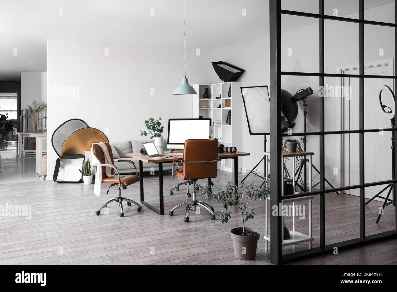Interior of modern office with photographer's workplace and ...