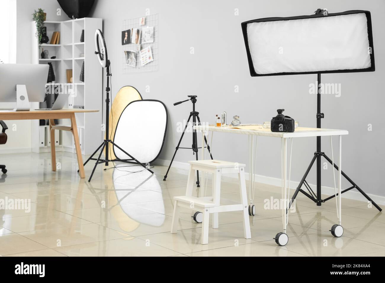 Interior of modern studio with photographer's workplace and equipment ...