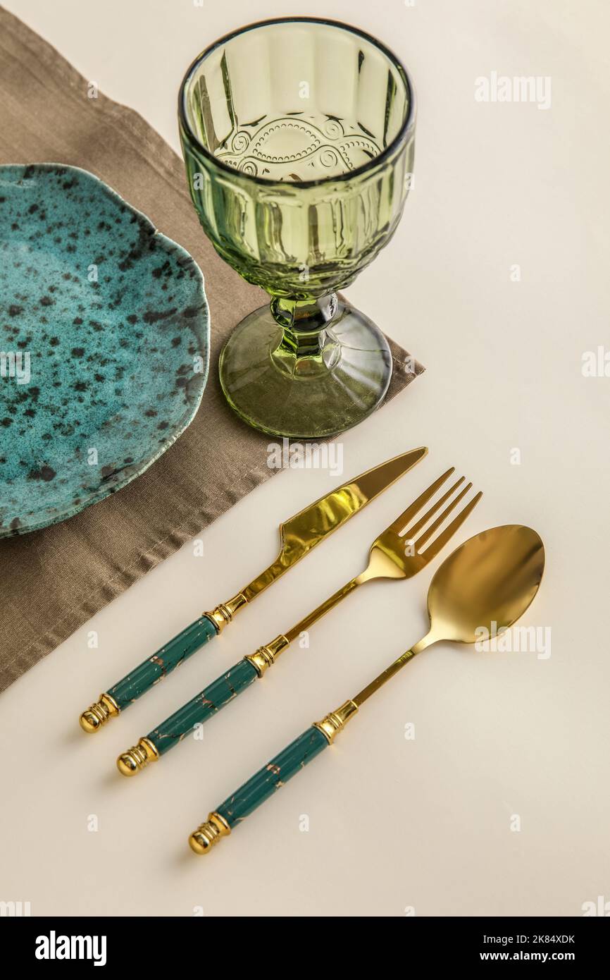Trendy table setting on white background Stock Photo - Alamy