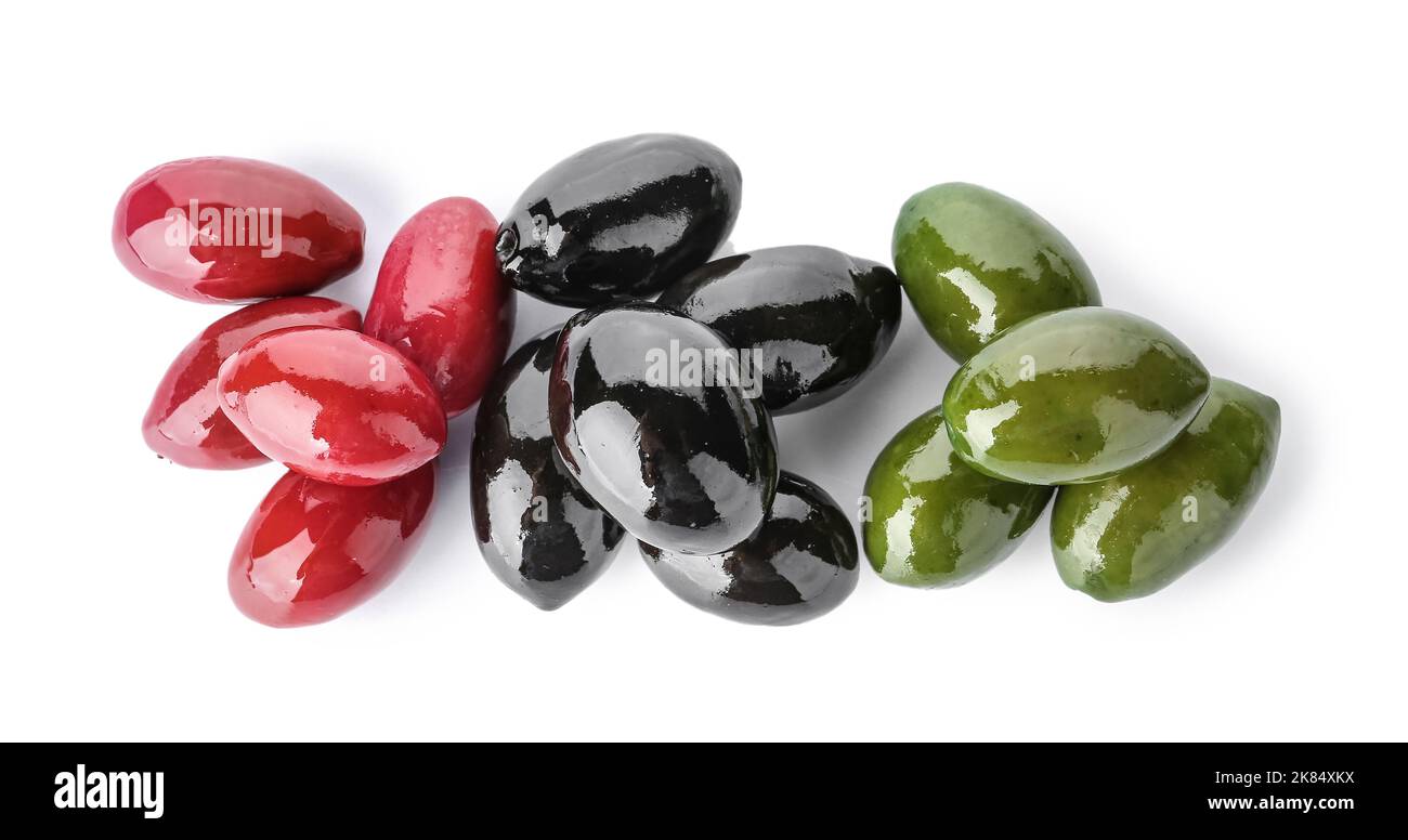 Heaps of tasty green, black and red olives on white background Stock ...