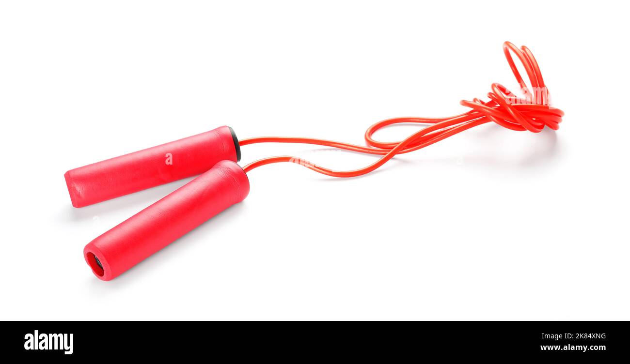 Red skipping rope on white background Stock Photo - Alamy