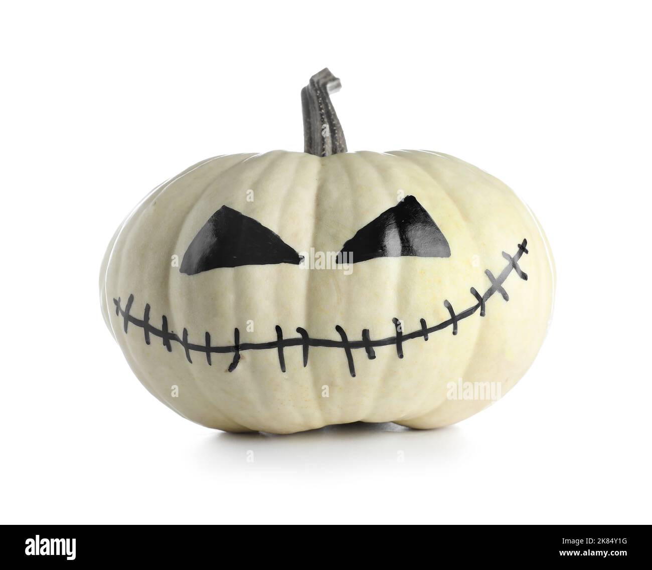 Halloween pumpkin with drawn face on white background Stock Photo - Alamy