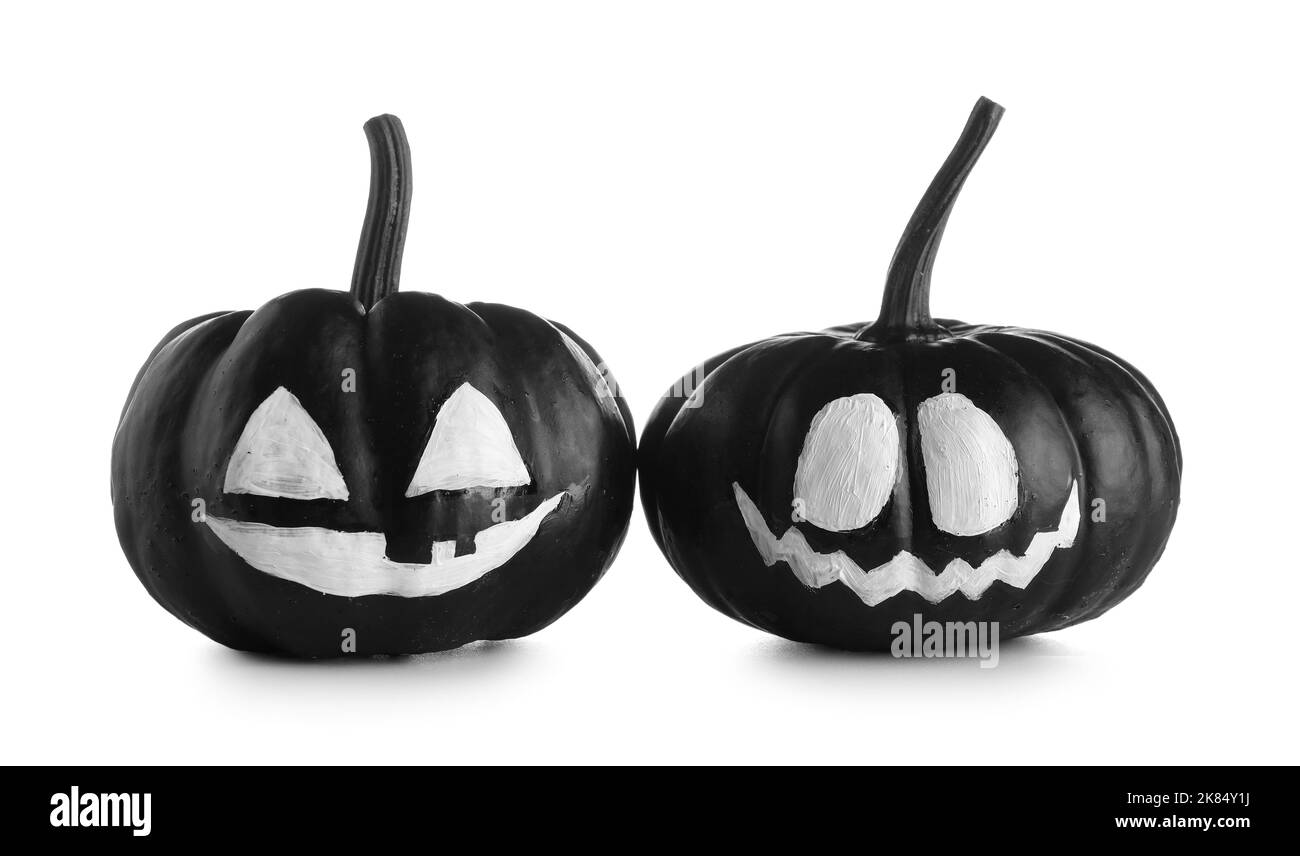 Black Halloween pumpkins with drawn face on white background Stock ...