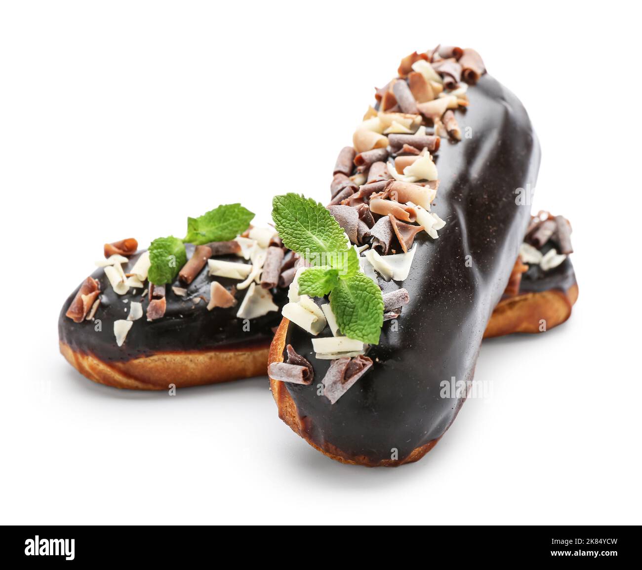 Sweet chocolate eclairs on white background Stock Photo - Alamy