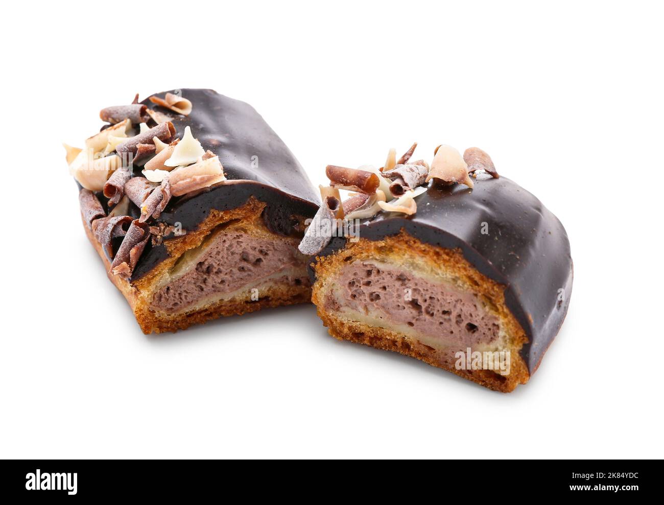 Pieces of sweet chocolate eclair on white background Stock Photo - Alamy