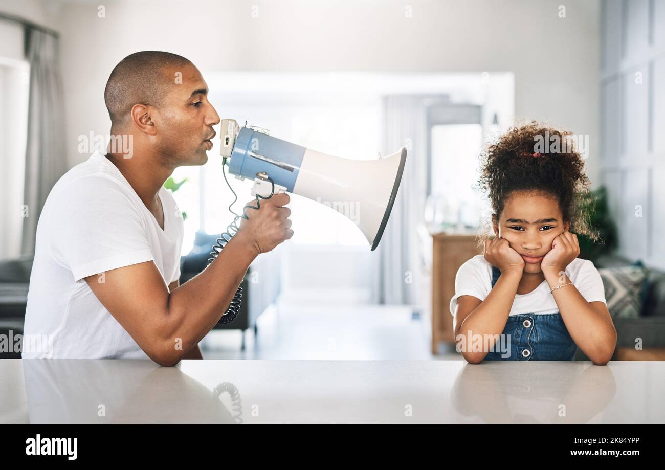 Can you hear me now. a young father reprimanding a child at home Stock ...
